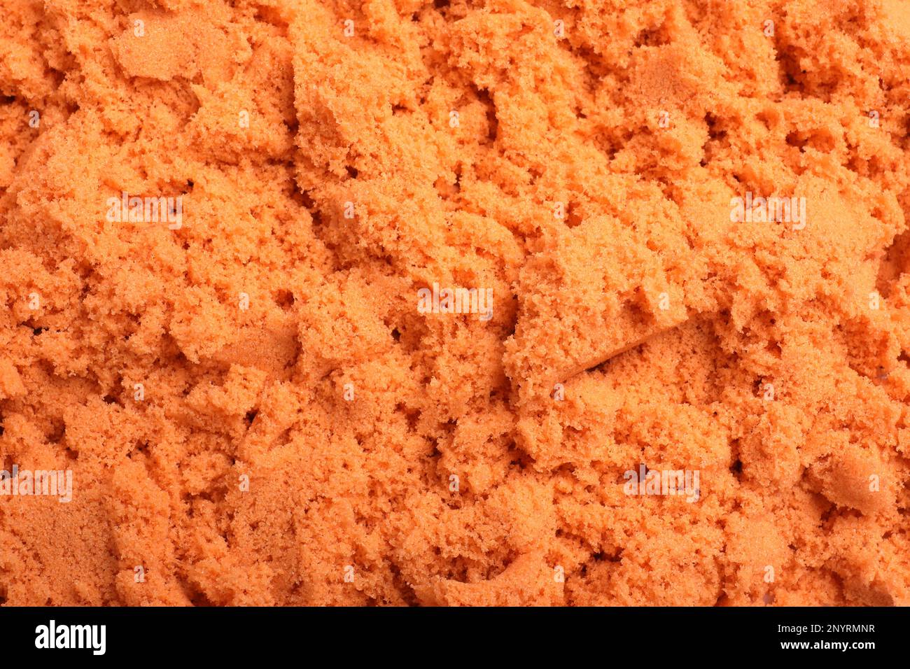 Orange kinetic sand as background, closeup view Stock Photo - Alamy