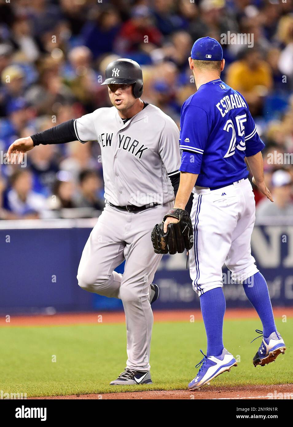 New York Yankees' Matt Holliday (17) nearly collides with Toronto Blue ...