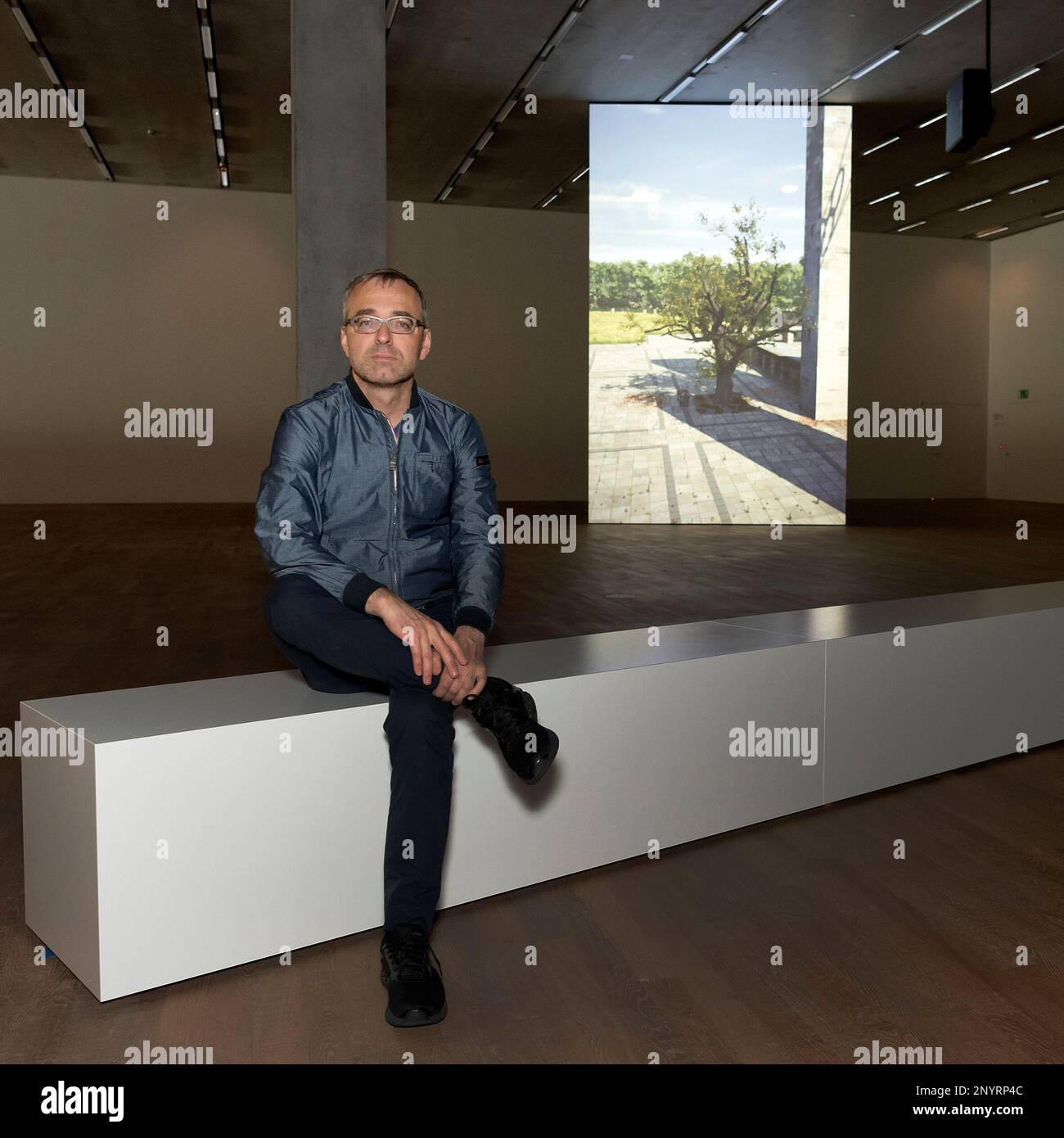 Belgian artist David Claerbout poses in front of his projection ...