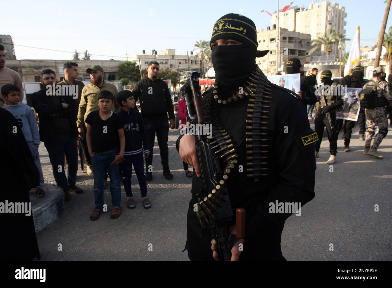 Masked Palestinian fighters of The Islamic Jihad movement take part in ...
