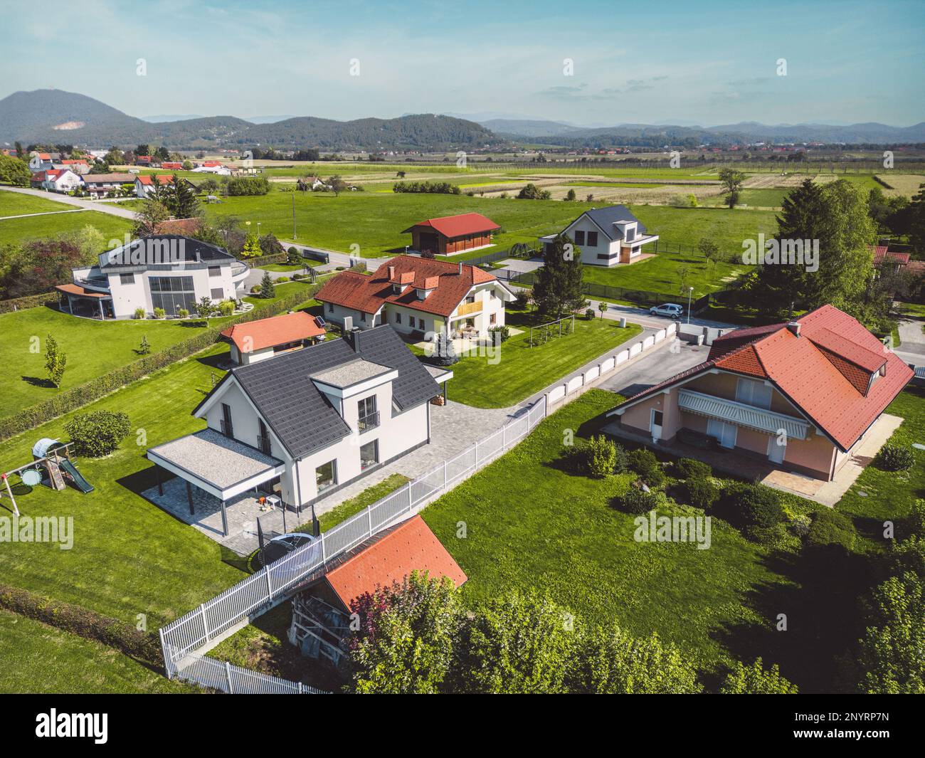 Aerial view of modern houses, family homes in the countryside with big ...