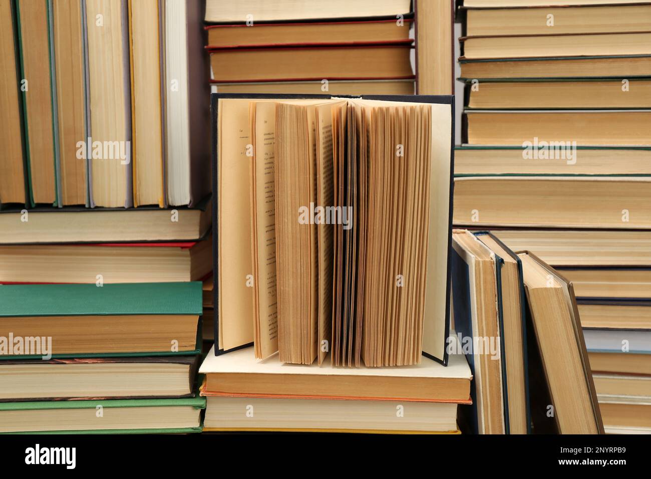 Many hardcover books as background. Library material Stock Photo - Alamy