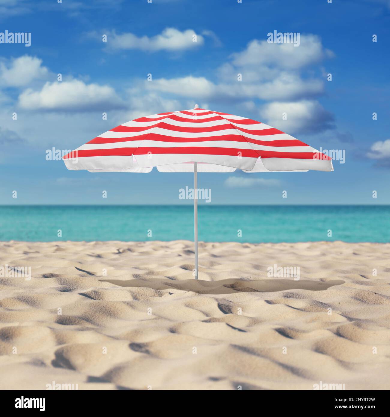 Open big beach umbrella on sandy coast Stock Photo - Alamy