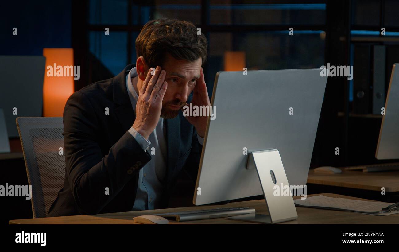 Exhausted Caucasian businessman adult man work overtime in office late ...