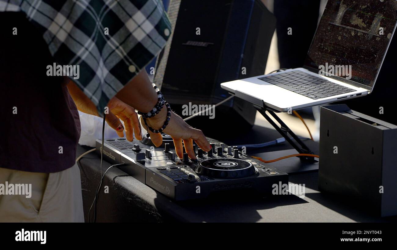 DJ playing and mixing music - street photography Stock Photo - Alamy