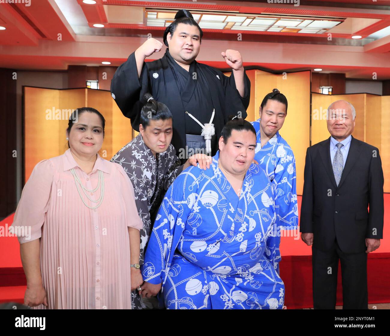 Sumo wrestler Takayasu (top ), riding the shoulders of his fellow poses ...