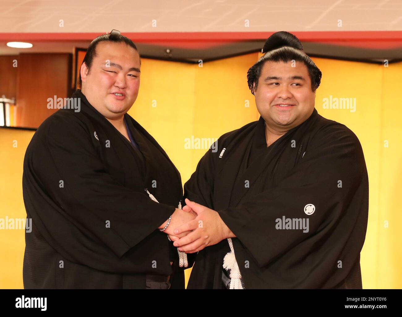 Sumo wrestler Takayasu (R) , shakes hands with yokozuna Kisensato after ...