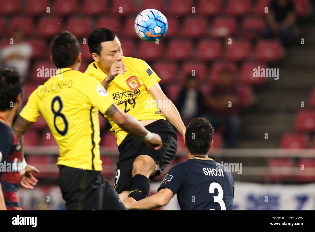 Gao Lin of China's Guangzhou Evergrande, back, heads the ball against ...