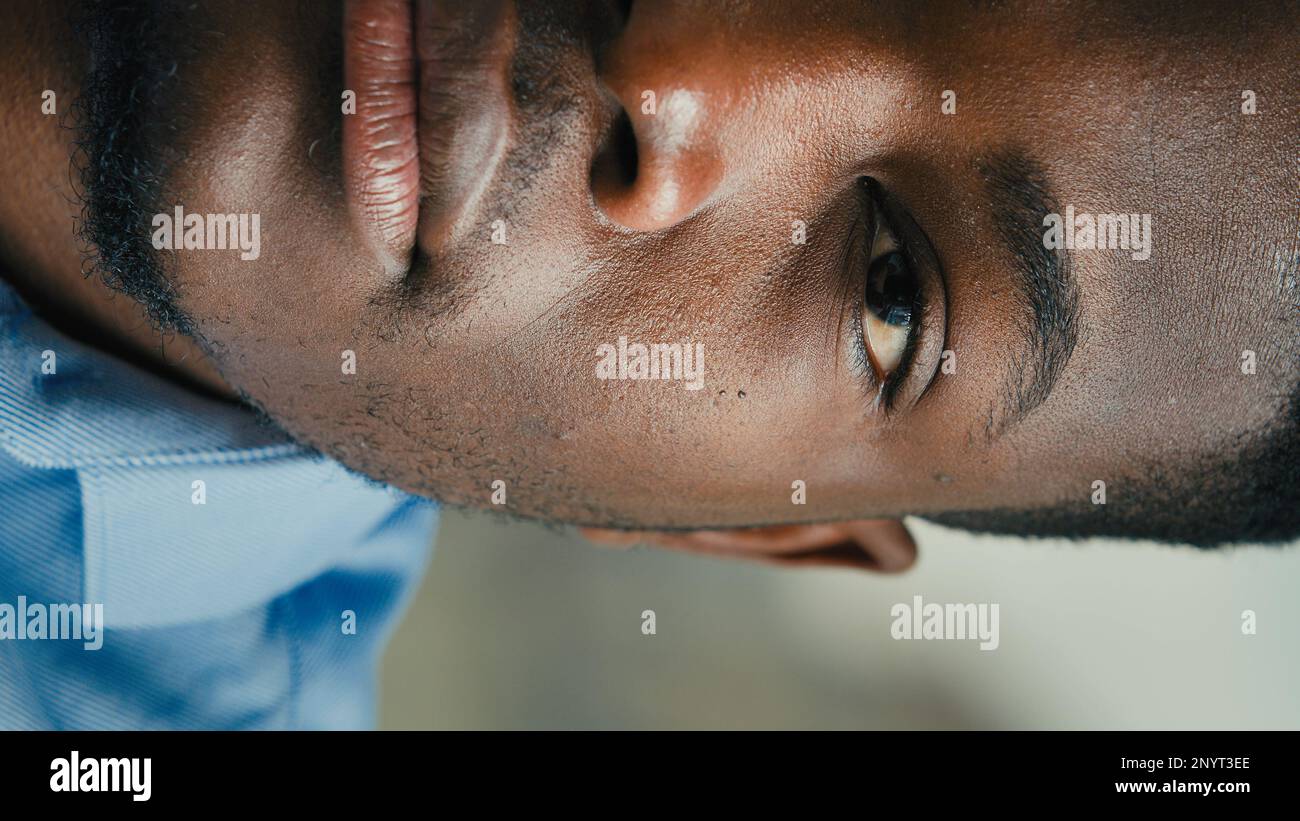 Vertical view close-up half part face African American ethnicity man ...
