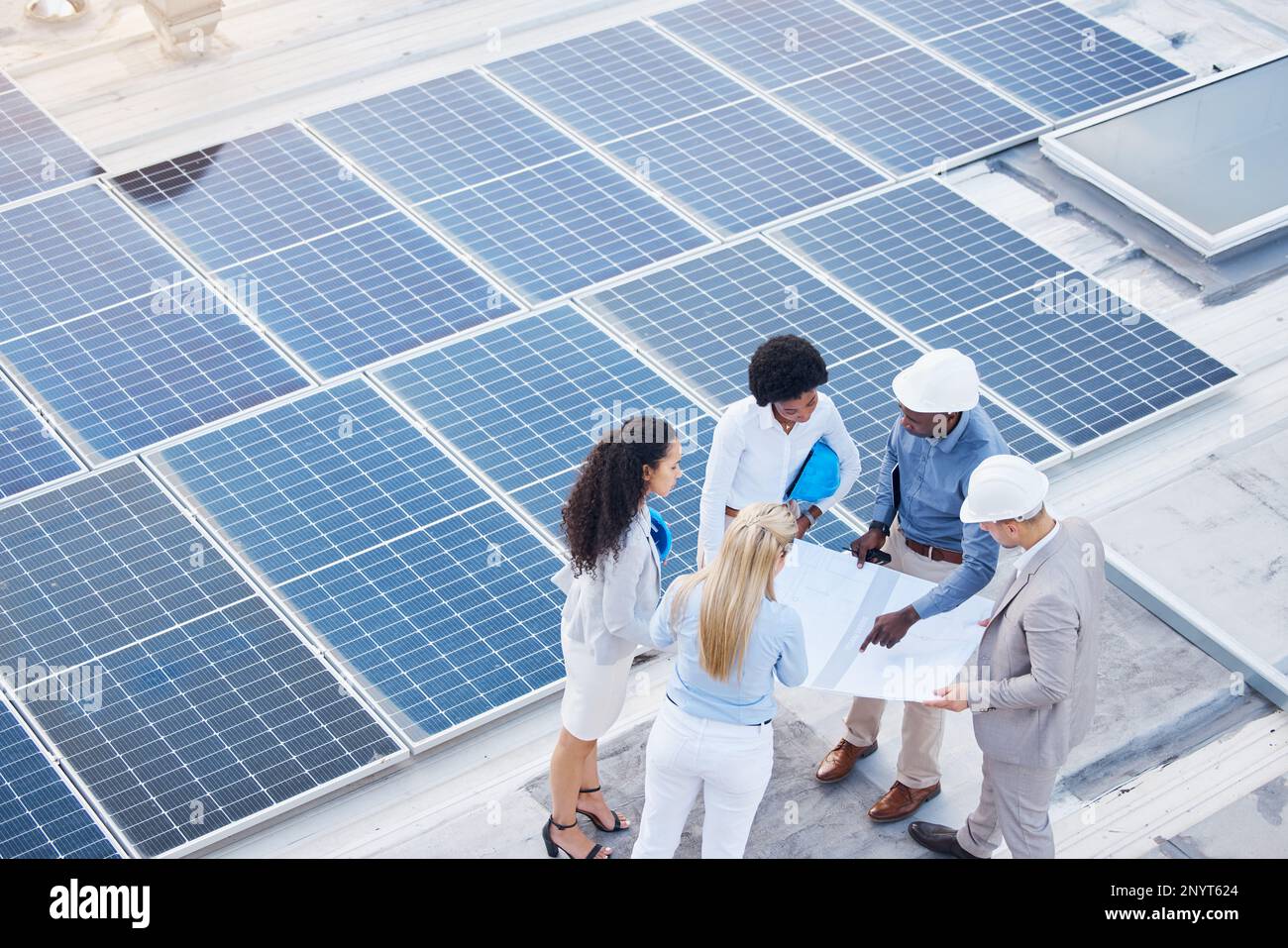 Solar energy, design or engineering team on roof building sustainable ...
