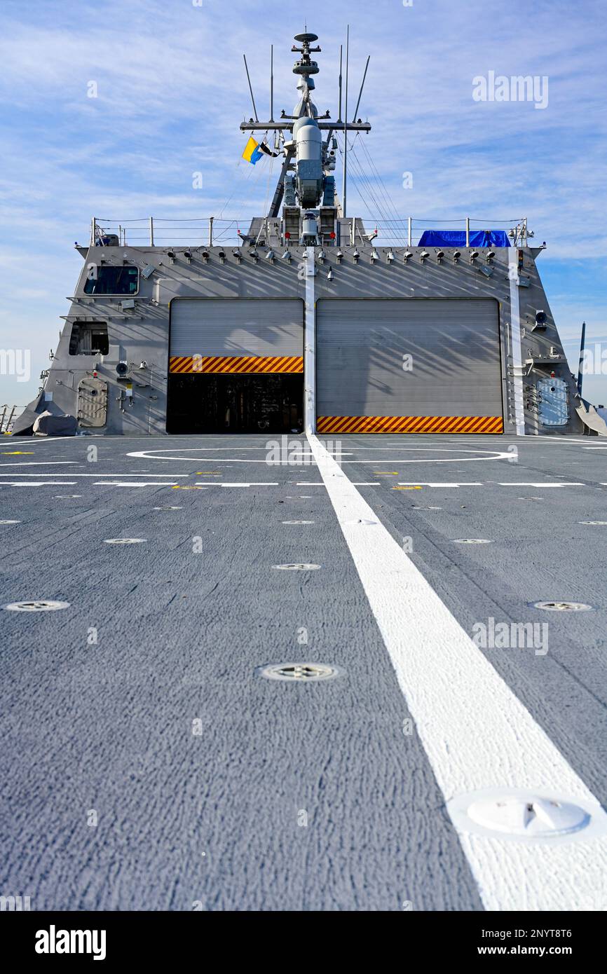 A hangar door is partially open on the flight deck of the Independence ...
