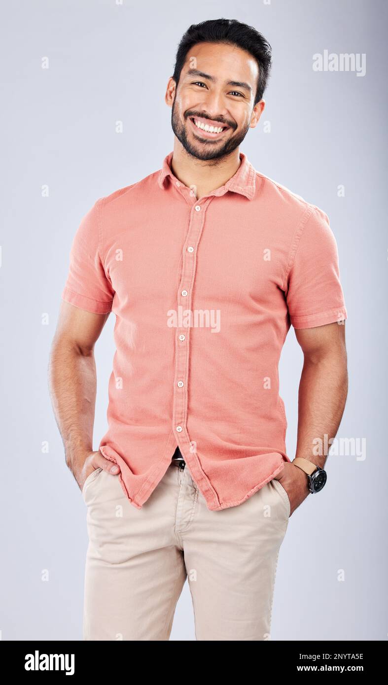 Fashion, happy and portrait of a man in a studio with a casual, trendy ...