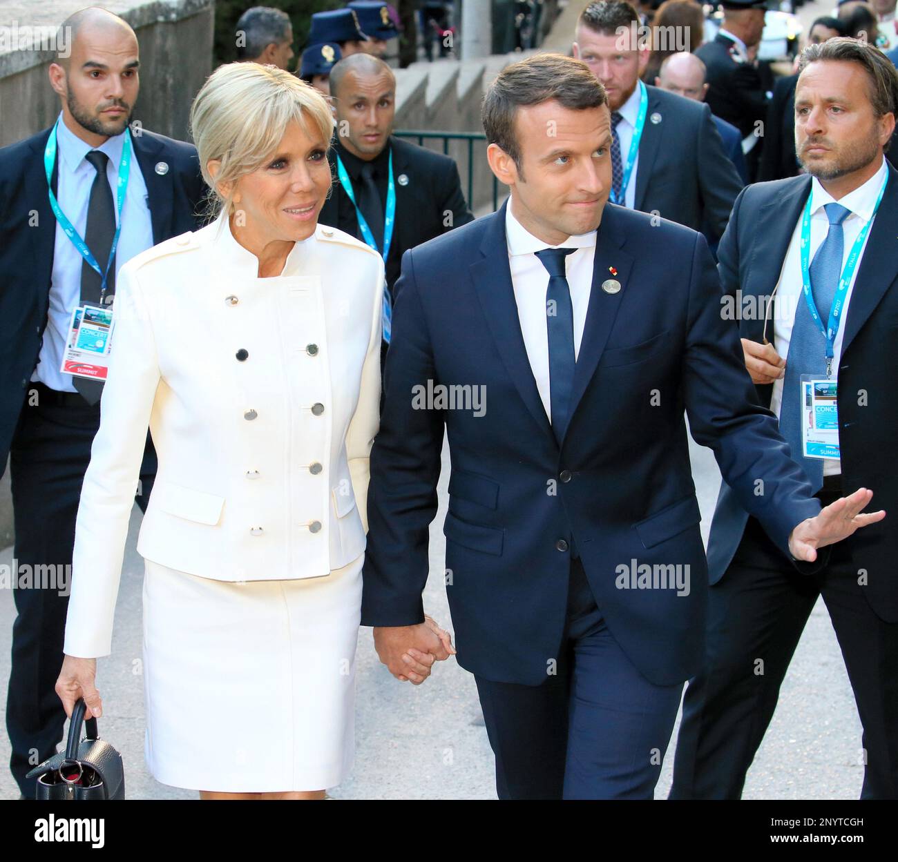 French President Emmanuel Macron (R) and his wife Brigitte attend a ...
