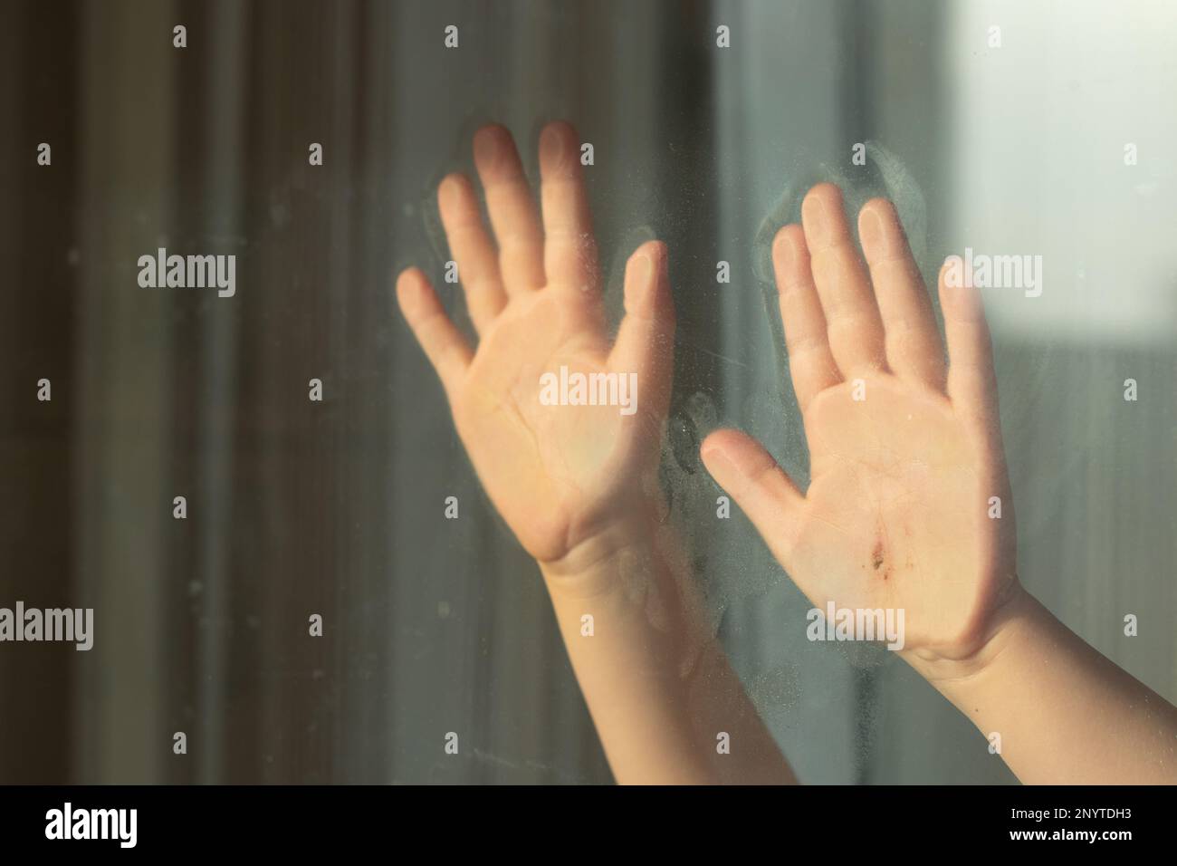 Children's hand with a notch on the glass during quarantine Stock Photo ...