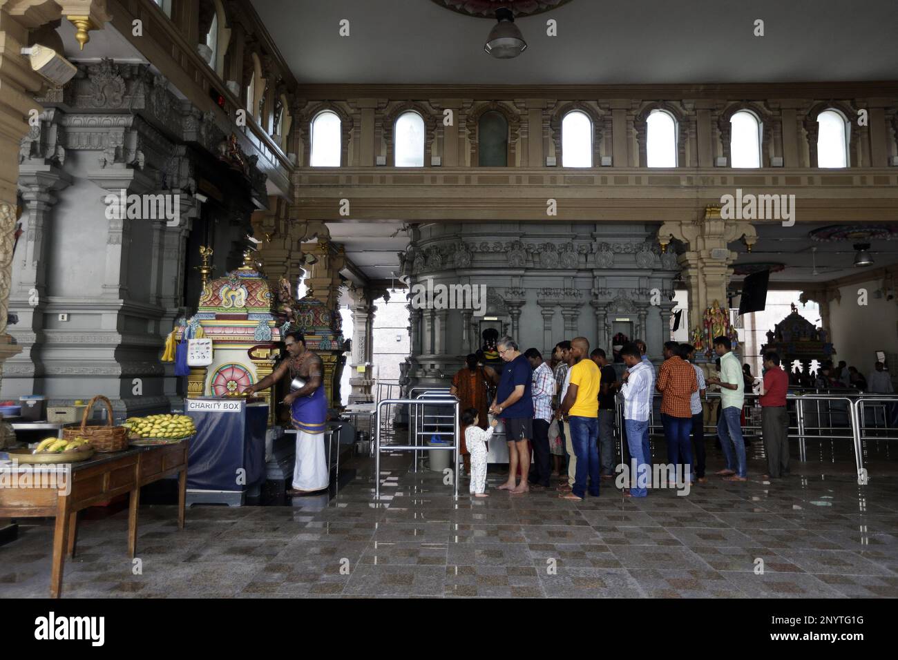 Interior of the Sri Thendayuthapani Temple, where devotees line up to ...