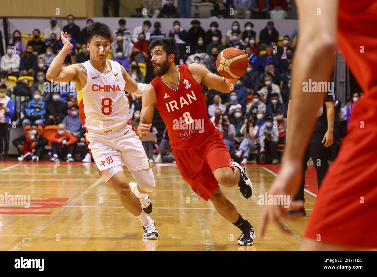 IranHH guard Behnam Yakhchali (right) dribbles past ChinaHH Zhao Rui ...