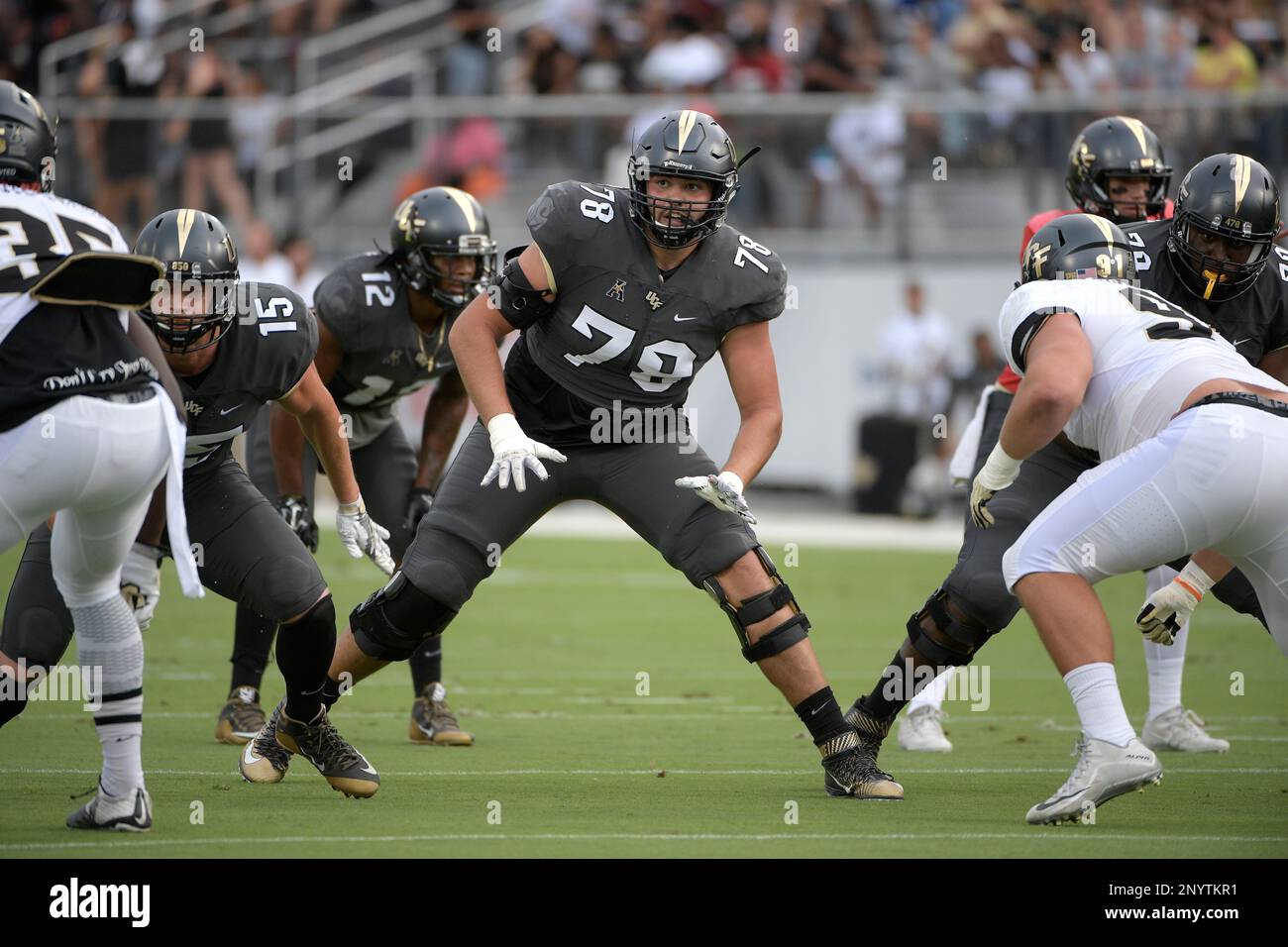 Central Florida offensive lineman Wyatt Miller sets up to block during ...