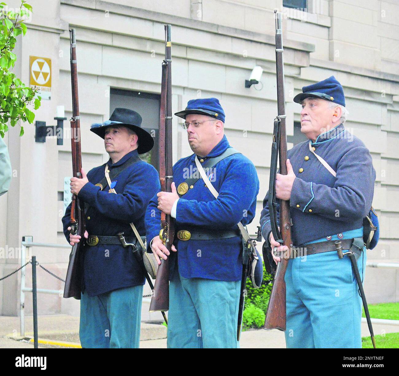 Civil War re-enactors stand at attention during a ceremony to ...