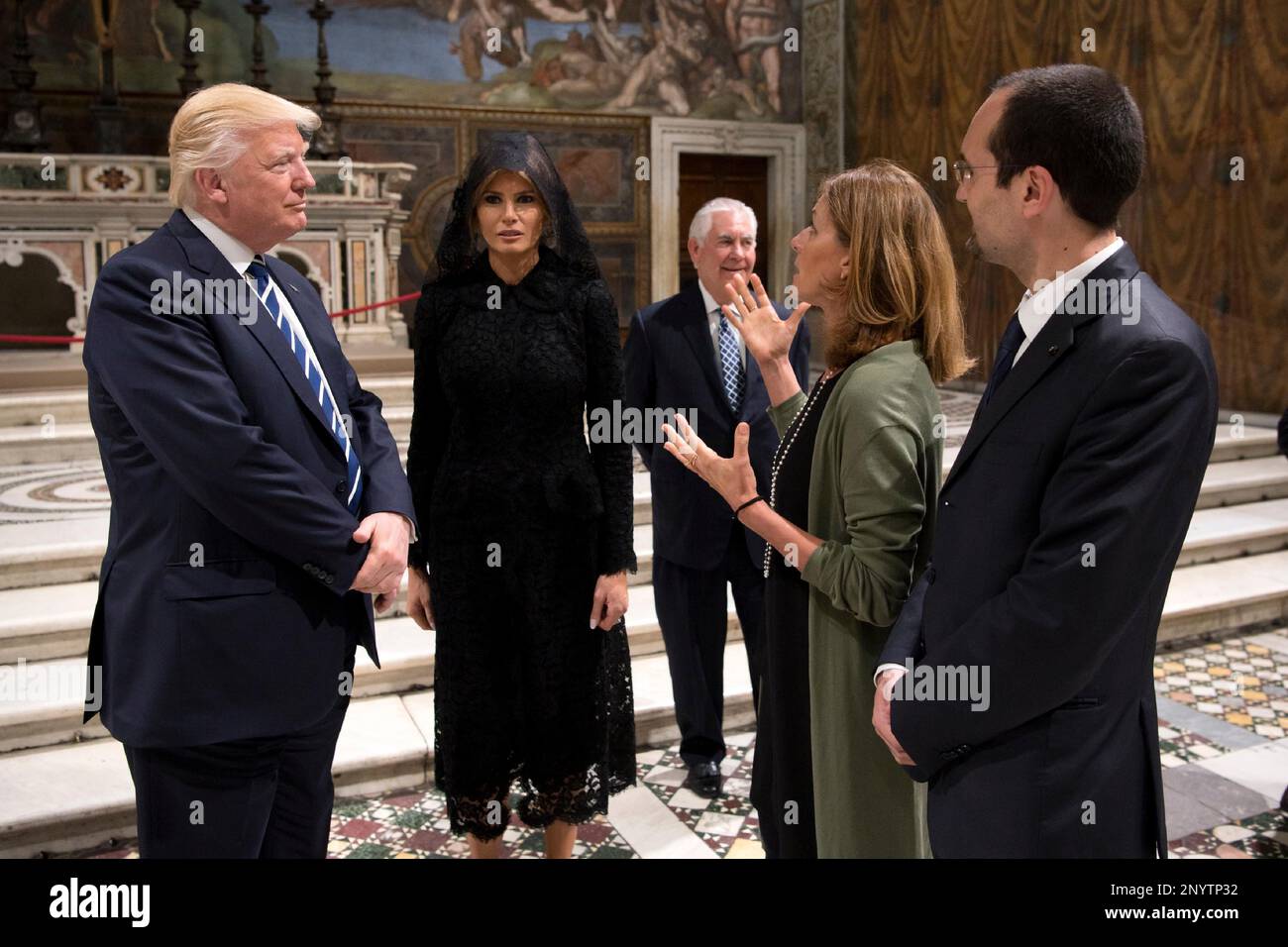 President Donald Trump and his wife Melania listen to a guide during ...