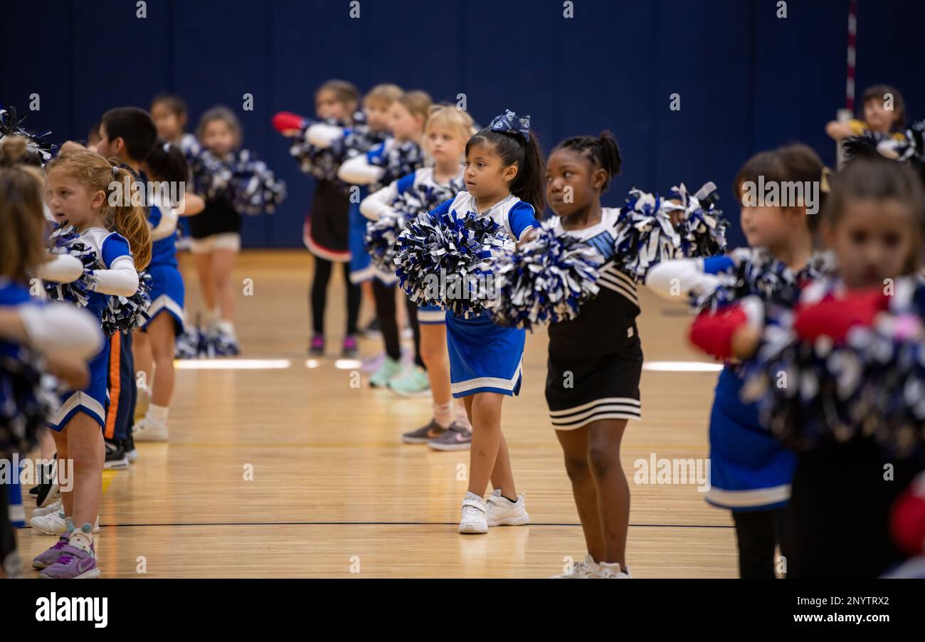 Marine Corps Air Station Iwakuni children perform a cheer routine with ...