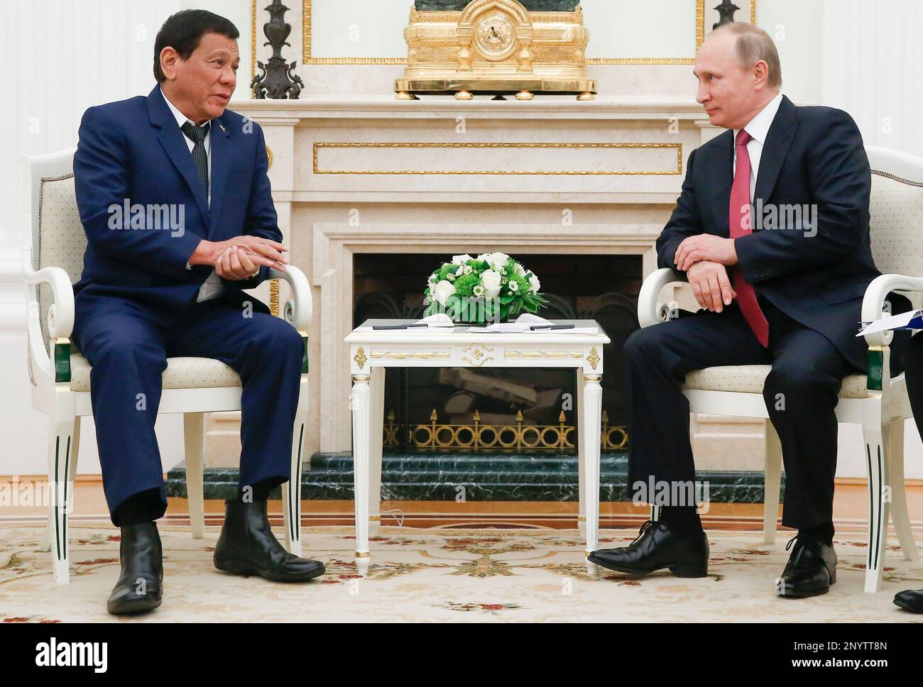 Russian President Vladimir Putin, right, listens to Philippine ...