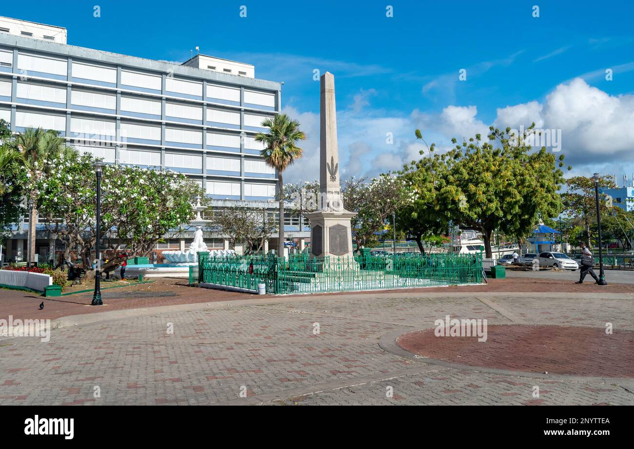 Downtown square with brick walkway and palm tree and historic marker in ...