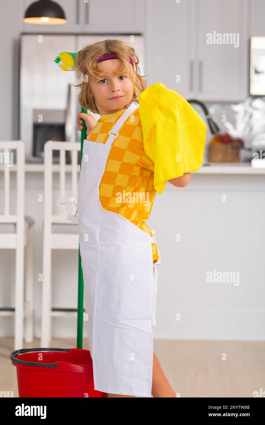 Little kid cleaning at home. Child doing housework having fun. Portrait ...