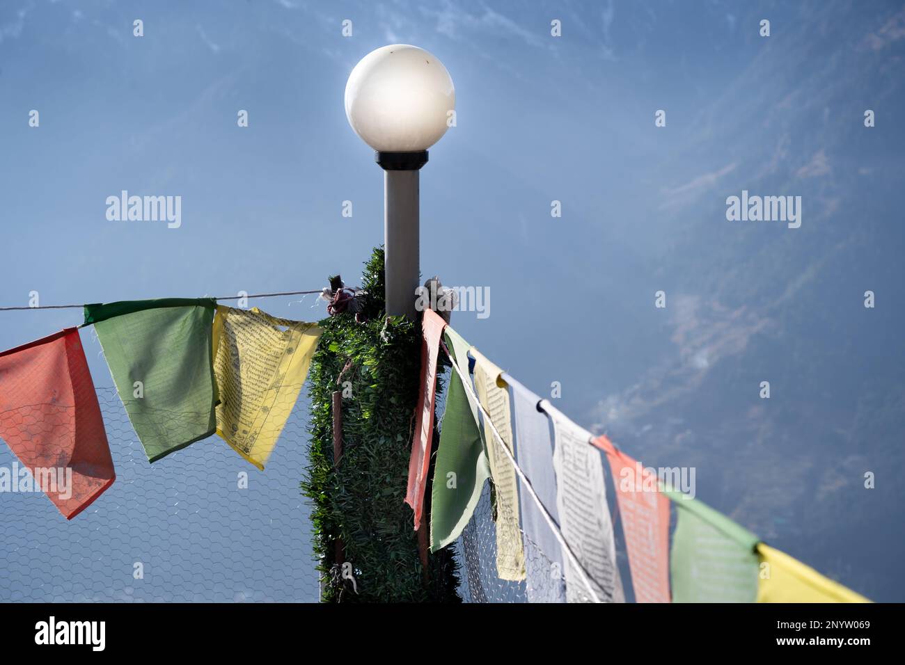 sacred religious multicolored prayer flags on fence moving in the wind ...