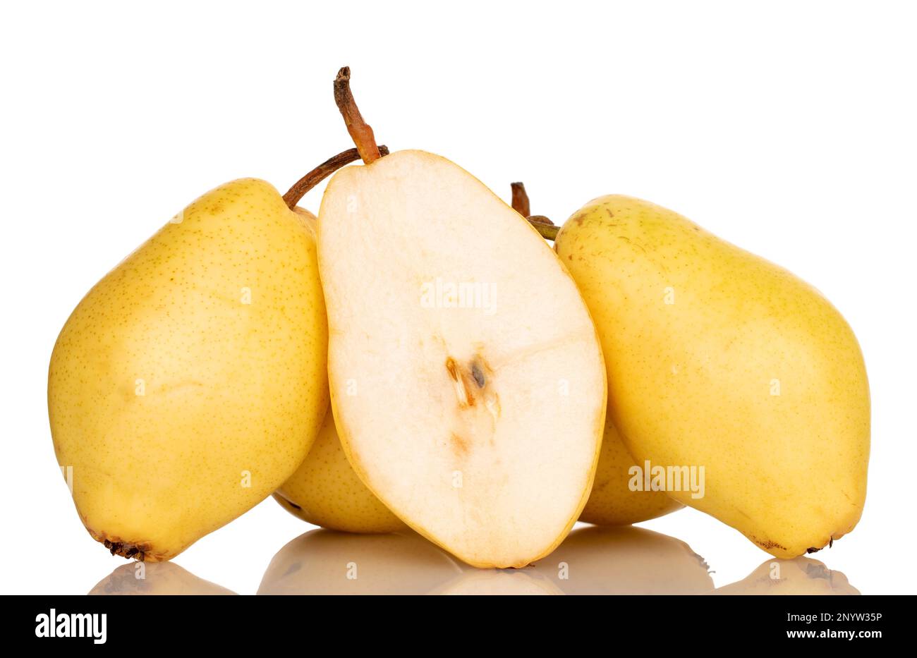 Several whole and one half organic yellow pears, close-up, isolated on ...