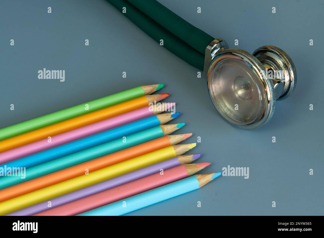 palette of colored pencils and a stethoscope representing the ...
