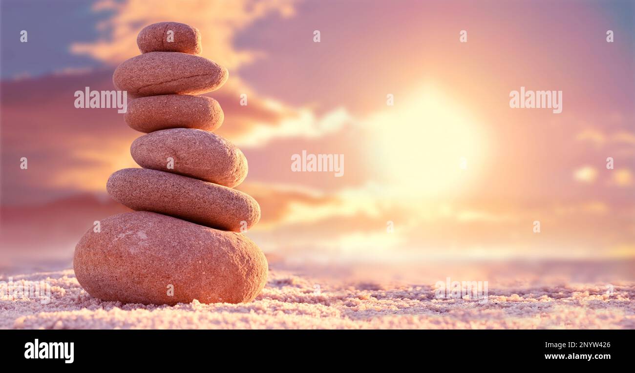 Stone tower. Natural pebble stone on the beach. Balancing body, mind ...