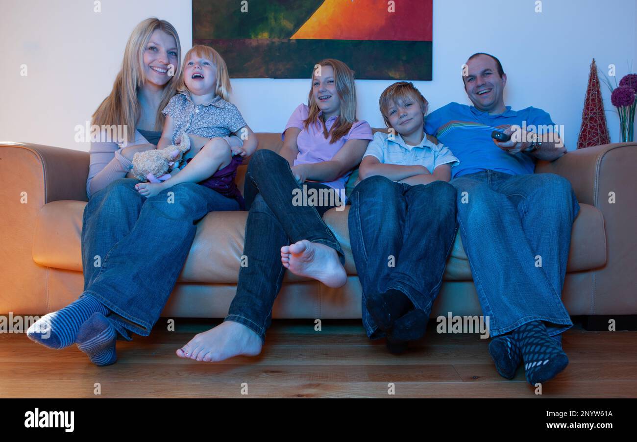 Family Life, TV Comedy. Fun and laughter on the faces of a young family ...