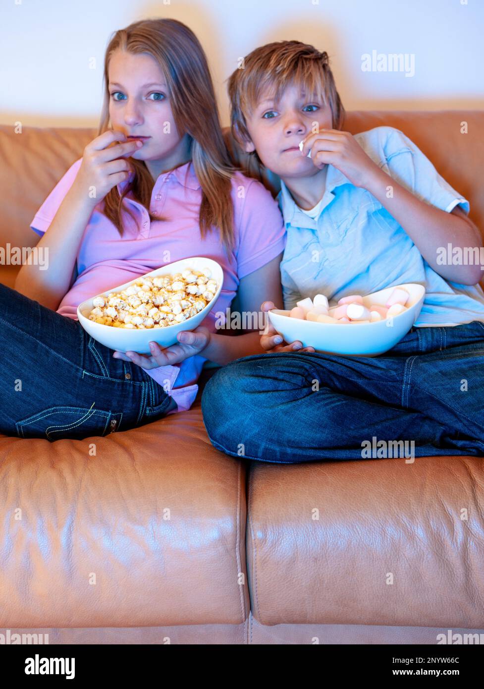 Family Life, TV Tension. Anxious siblings distracted from their popcorn ...