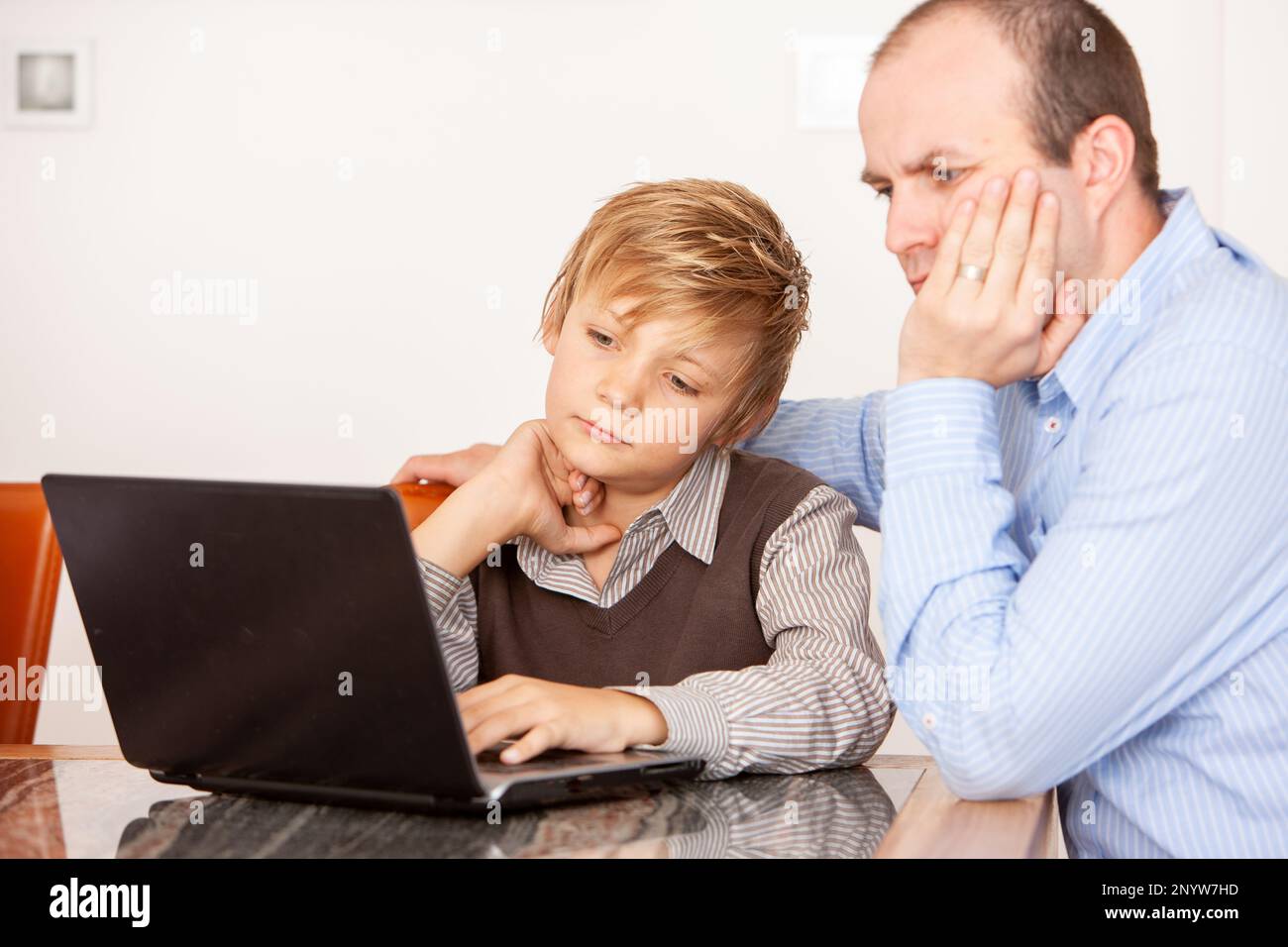 Family Life, Problem Solving. A father and son working together on a ...