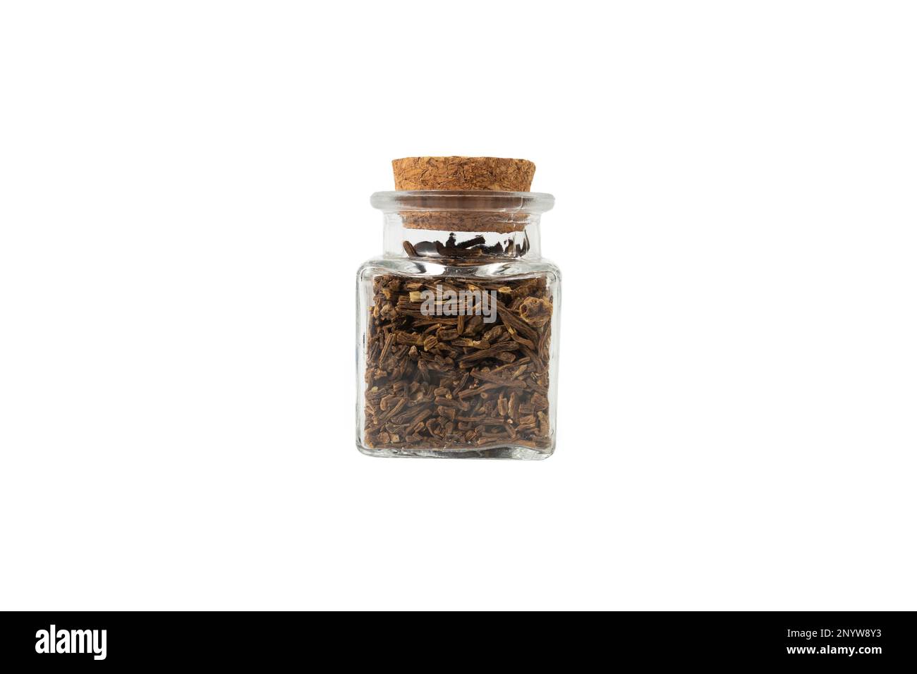 Valerian herb root in a glass jar isolated on white background ...