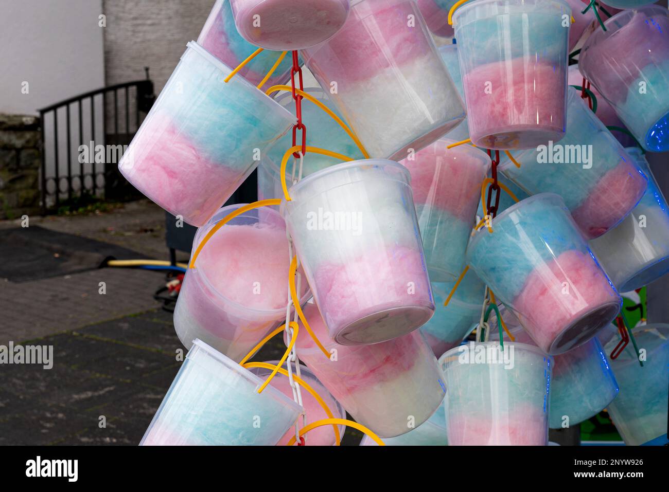 Sweet soft sugary cotton wool dessert in non-ecological polyethylene ...