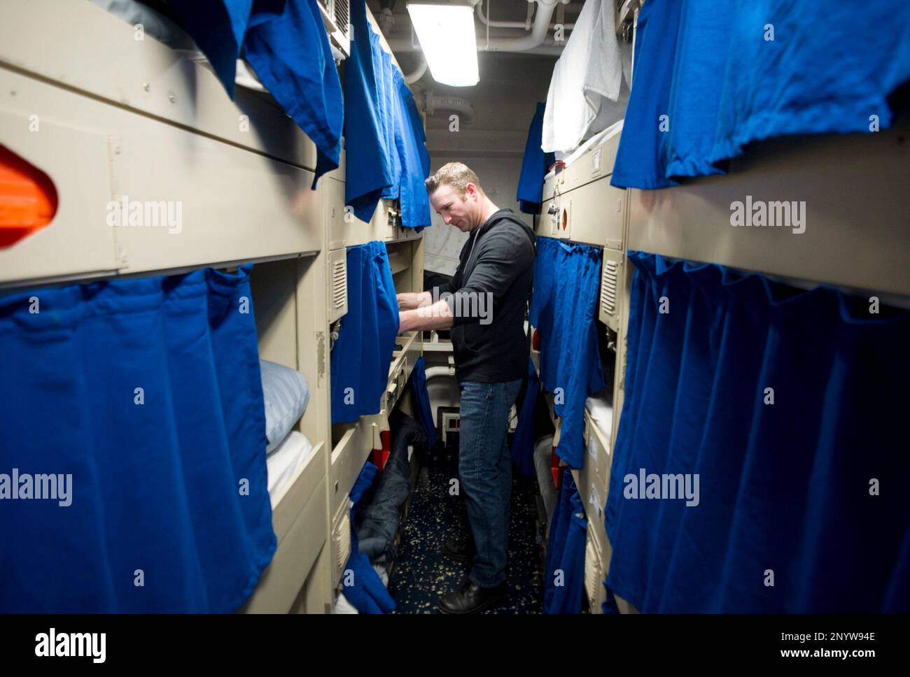 In this May 15, 2017 photo, Ryan Grabill cleans up at his bunk in the ...