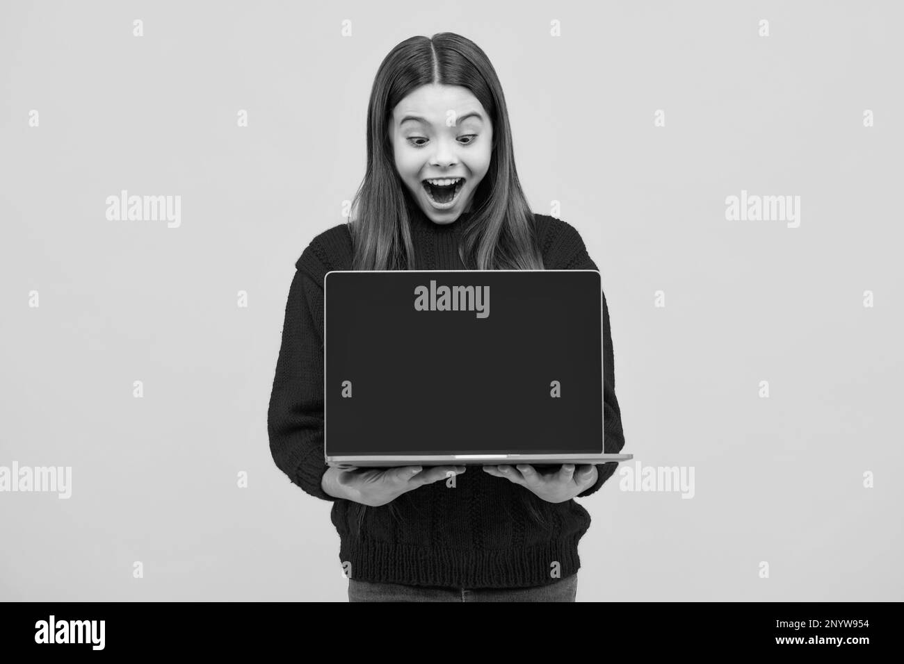 Excited face. Amazed teenager. School student using laptop. E-learning ...