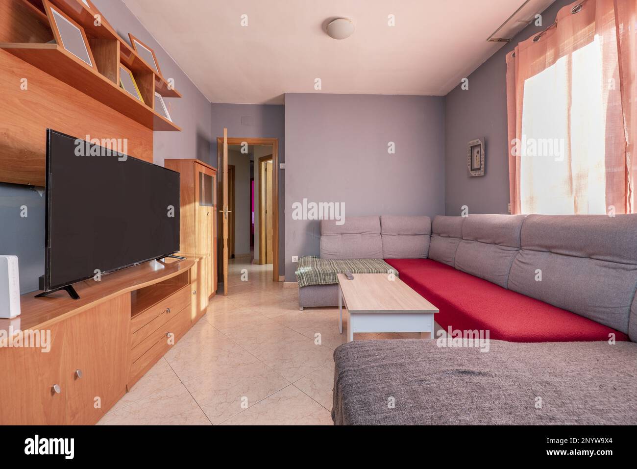 Living room furnished in the conventional style of a house with cherry ...