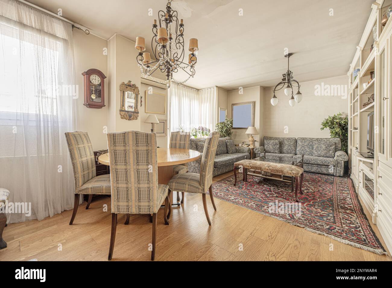 living room with a variegation of furniture and colors with a Persian ...