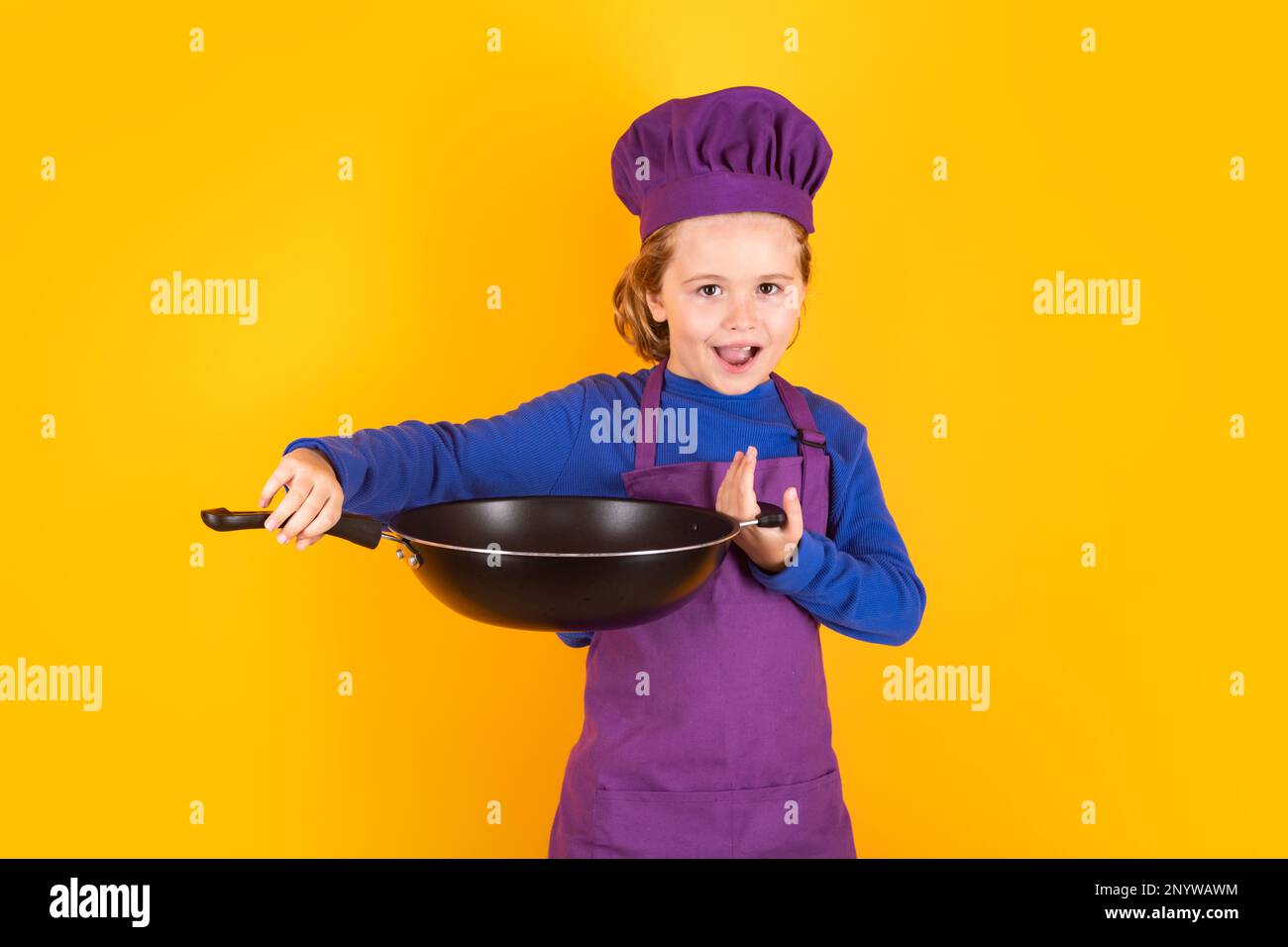 Kid boy chef cook with cooking pan. Chef child preparing healthy food ...