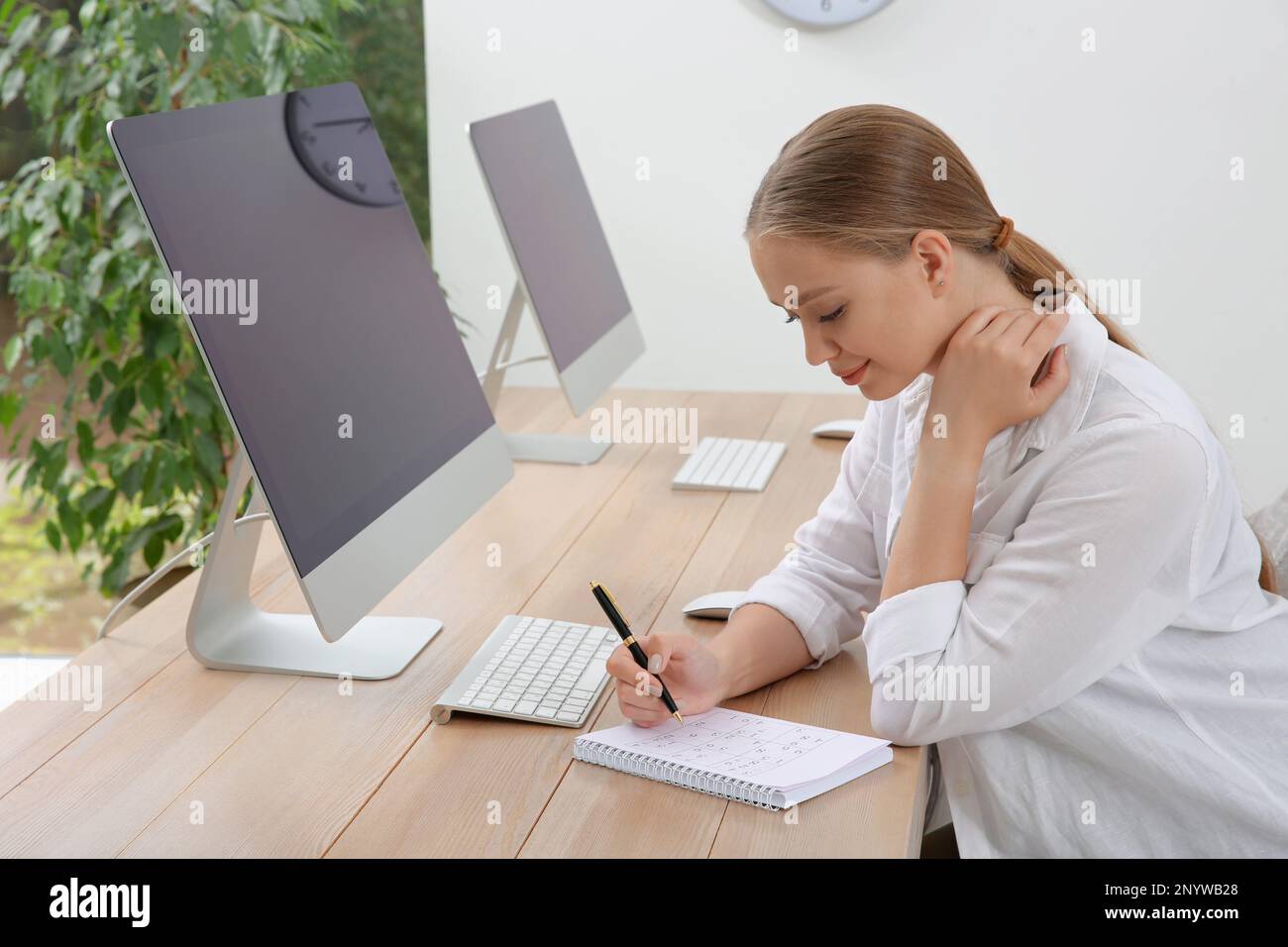 Happy woman solving puzzle hi-res stock photography and images - Alamy