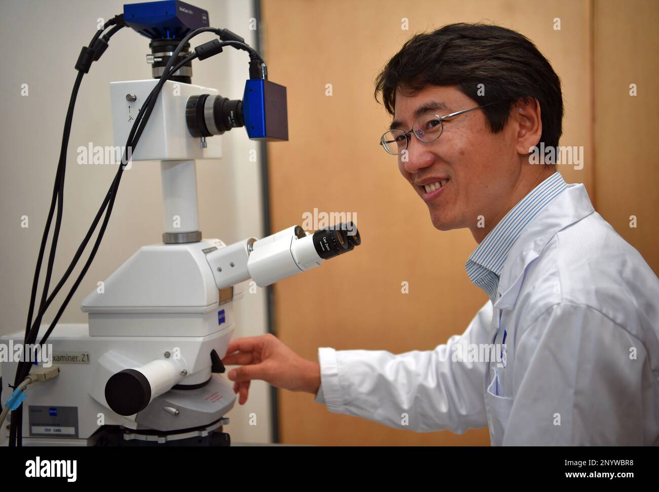 Dr Han Weiping from the Singapore Bioimaging Consortium and his team ...