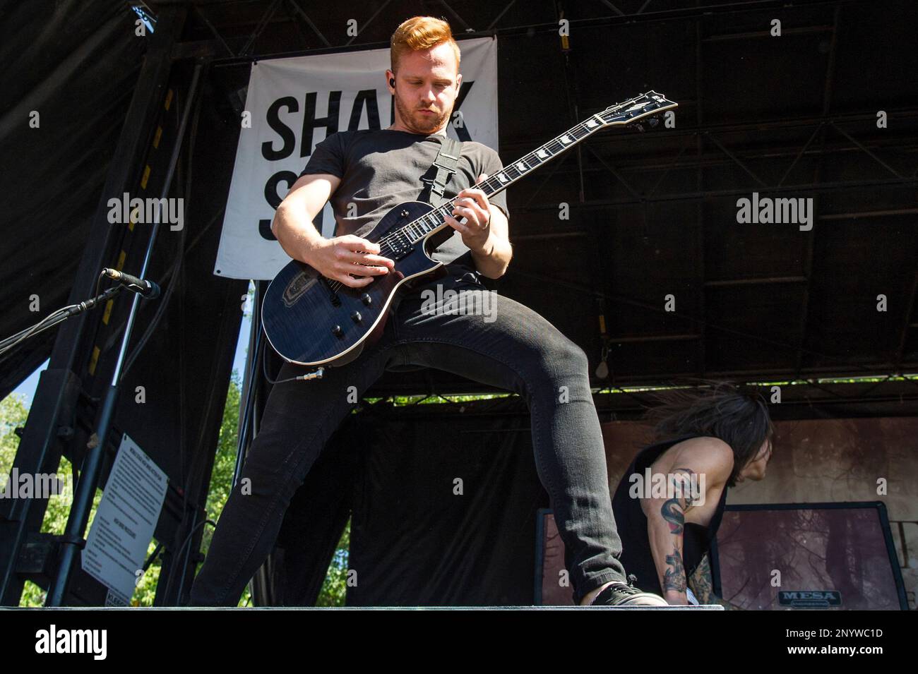 Eric Lambert of Blessthefall performs during the 2015 Vans Warped Tour ...