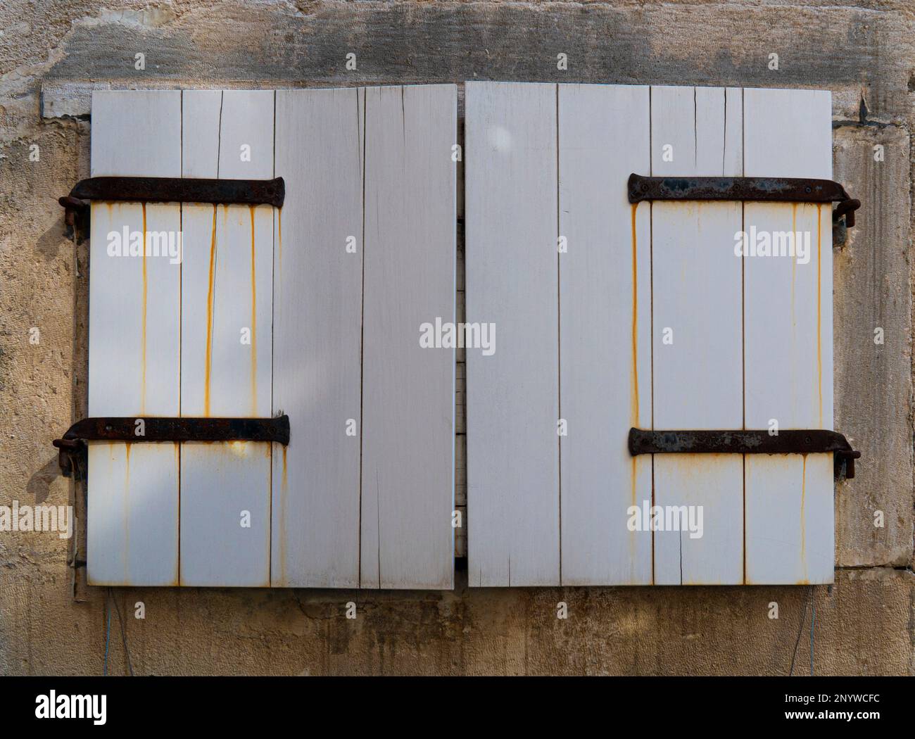 Building's facade. Wall of an old house. Closed wooden window ...