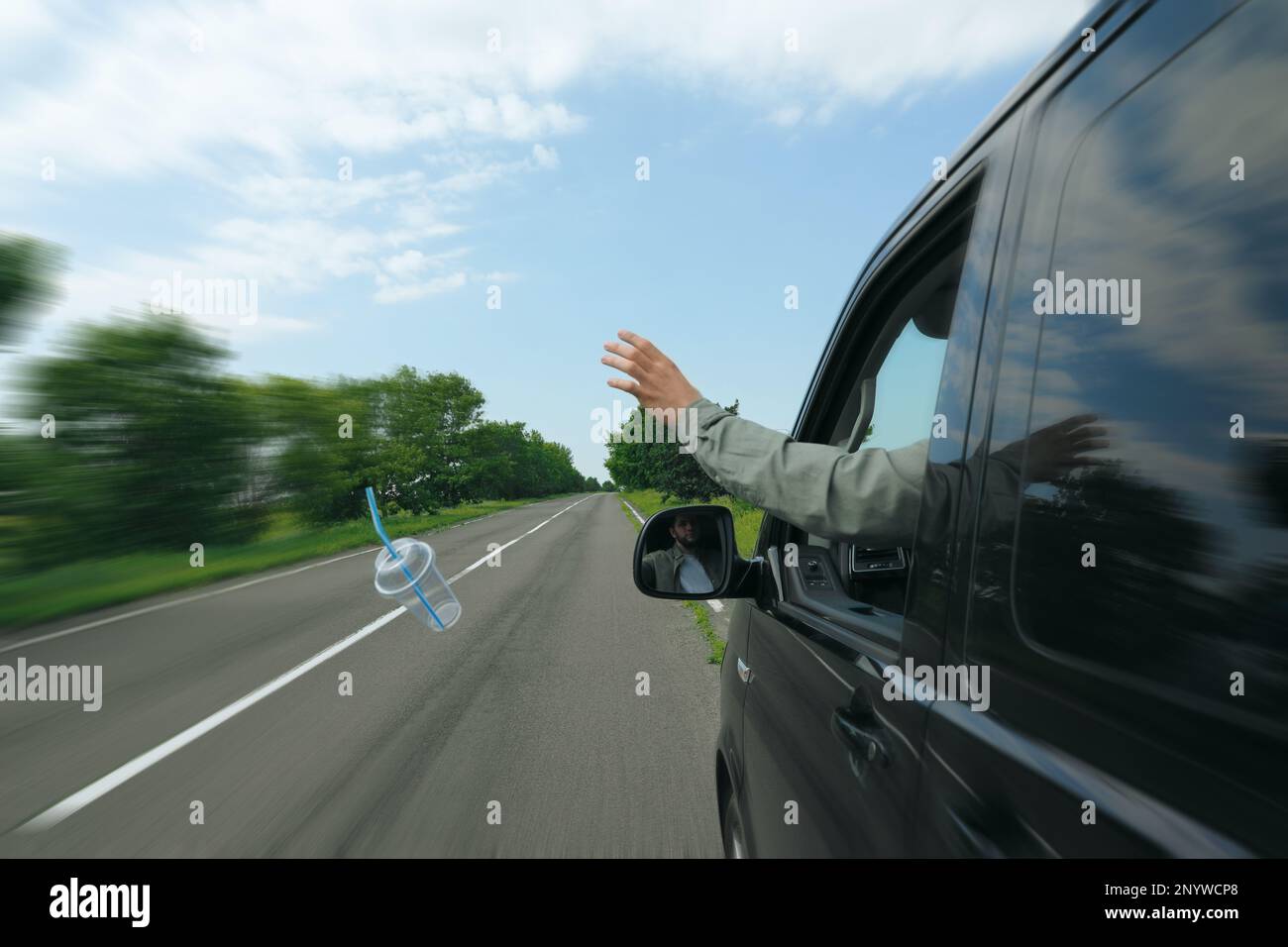 Driver throwing away plastic cup from car window. Garbage on road Stock ...