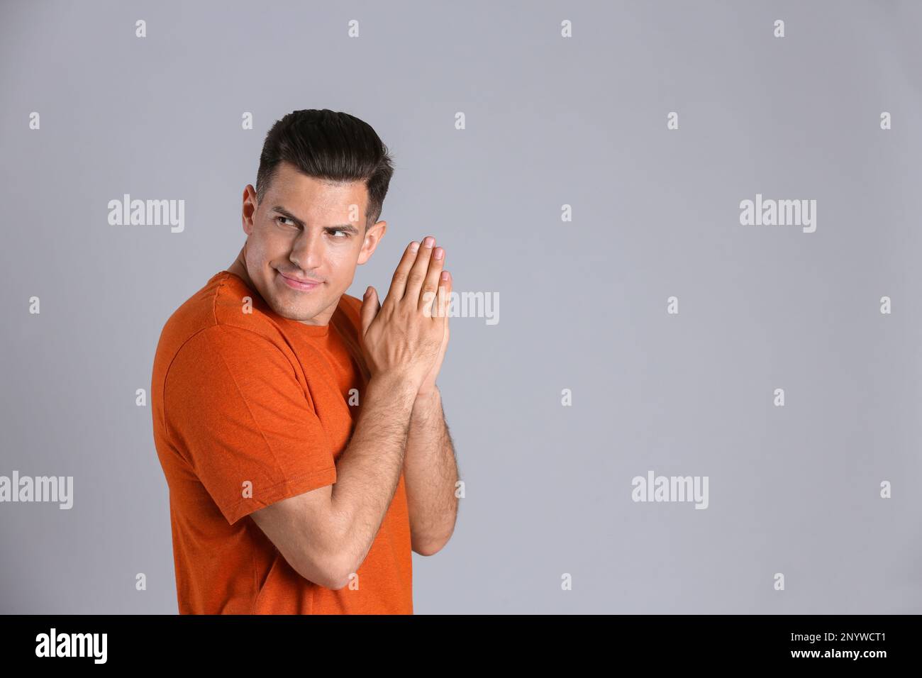 Portrait cunning guy rubbing hands hi-res stock photography and images ...