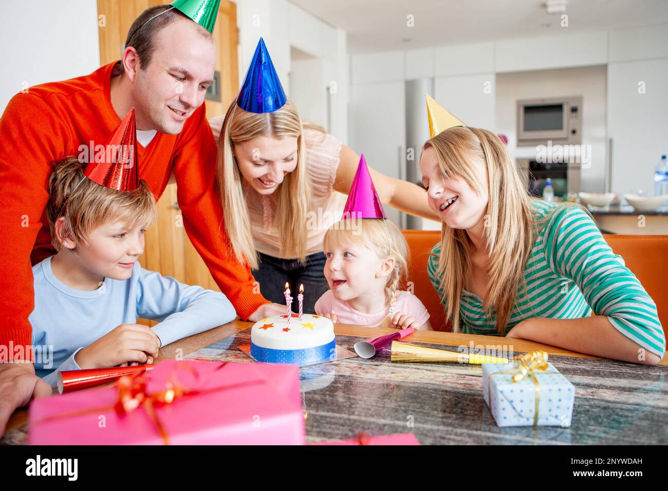 Family Life, Surprise Birthday. A young family party celebrating the ...