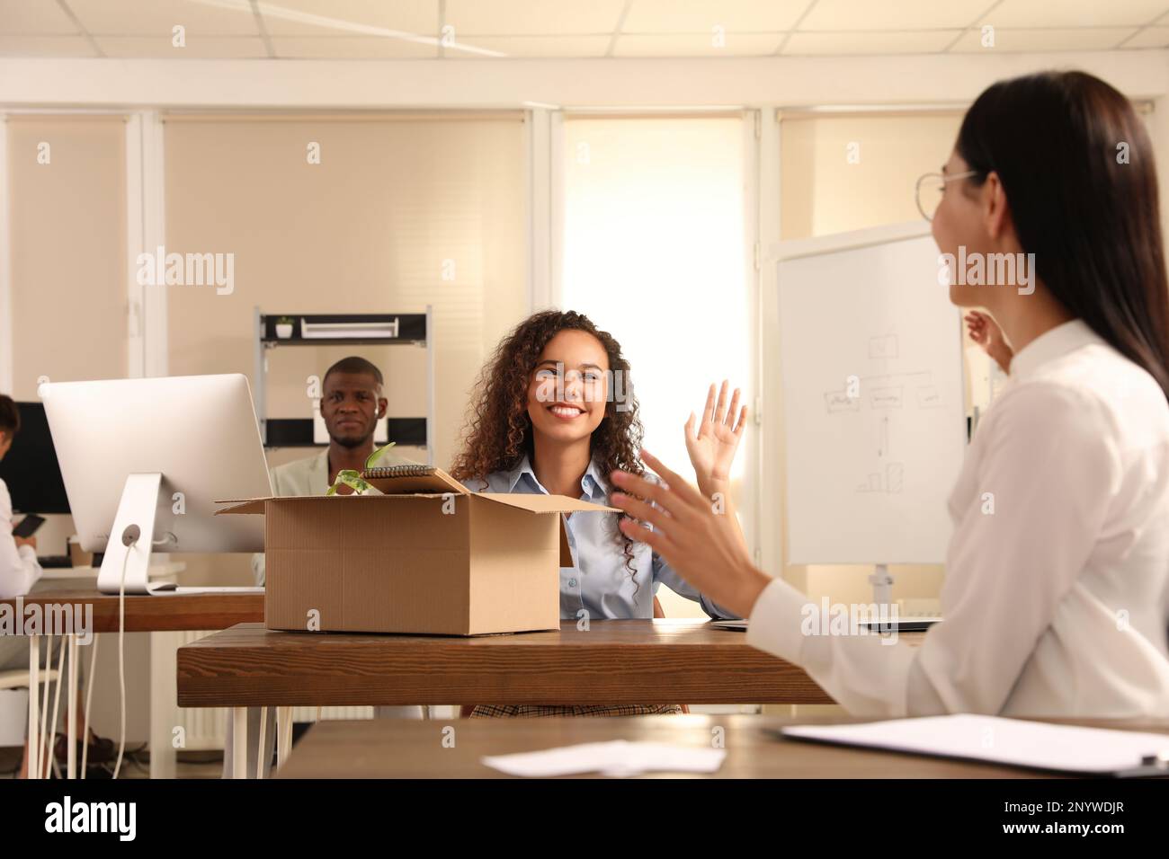 Employee greeting new coworker in modern office Stock Photo - Alamy