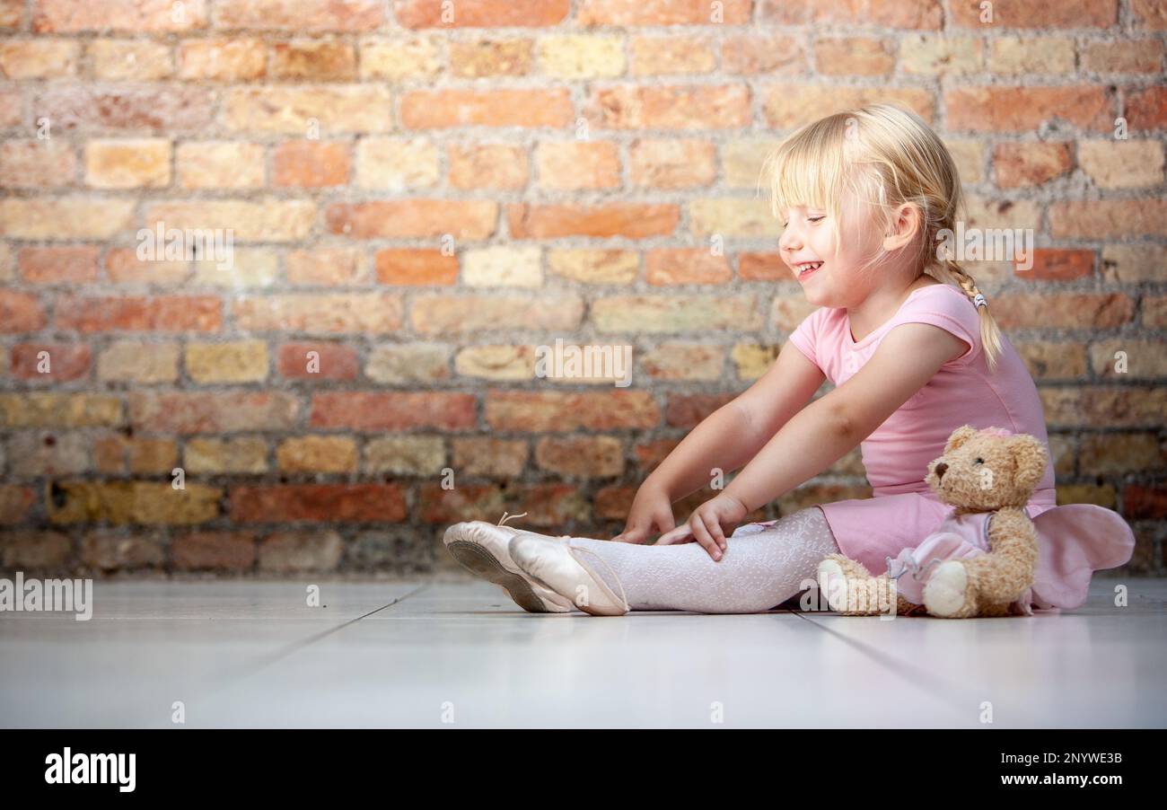 Family Life, Little Ballerina. A young girl practicing her first ballet ...